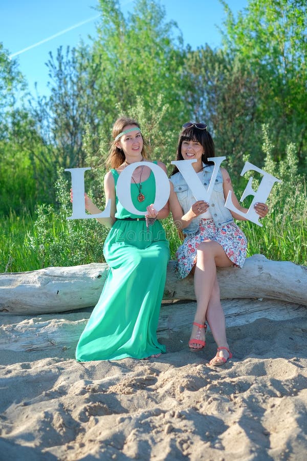 Two Young Women in the Park Stock Photo - Image of boho, hair: 96654536