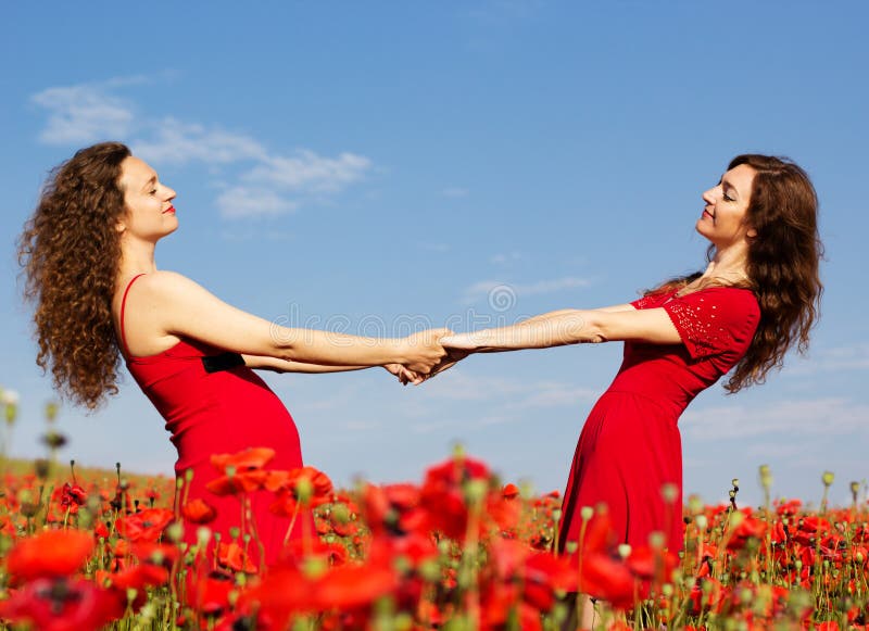 Two Young Women Playing in Poppies Field Stock Image - Image of human ...