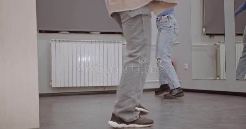 Two Young Women Practice Energetic Hip Hop Dance Routine in Modern ...