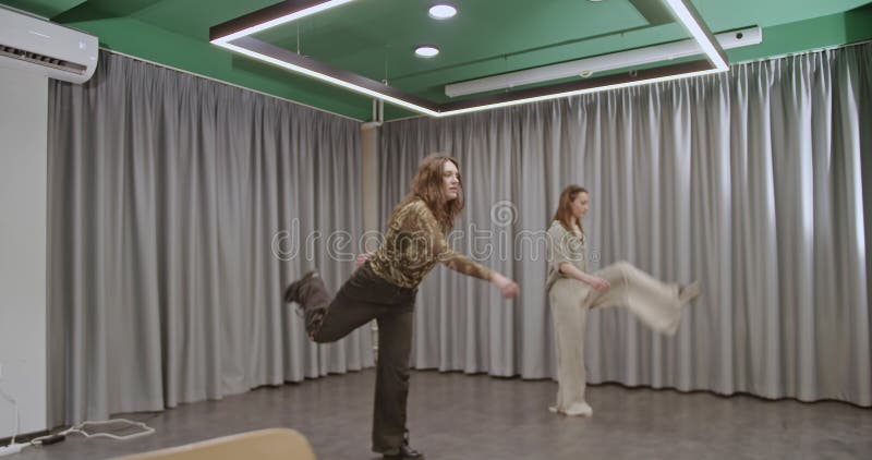 Two Young Women Practice a Modern, Contemporary Dance Routine in a ...