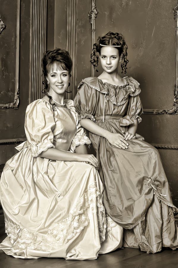 Two Young Women in Retro Dresses Stock Image - Image of corset, females ...