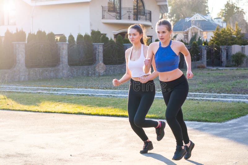 Young Women Running at Sunset Stock Photo - Image of sports, female ...