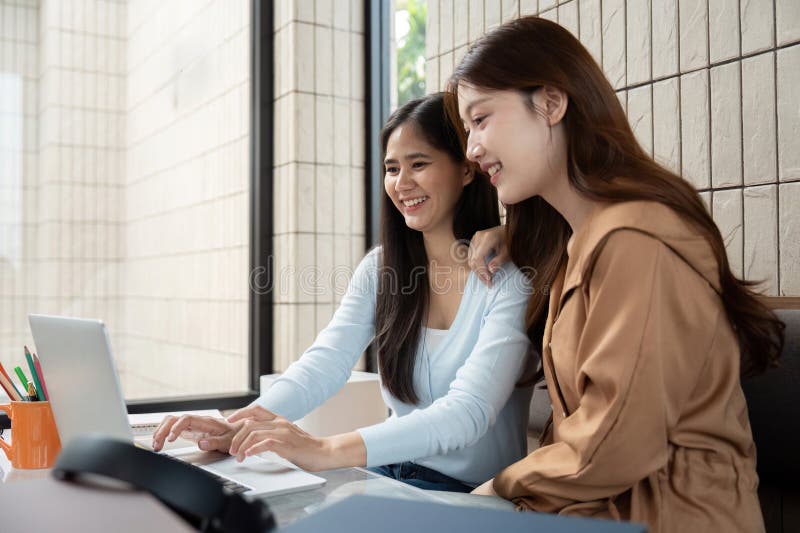 Study Friendship and Technology. Two Students Bond Over Their Laptop As ...
