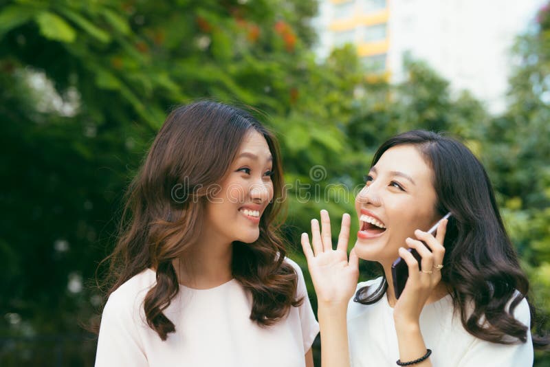 Two Young Women Socializing Outdoors. Stock Photo - Image of friend ...