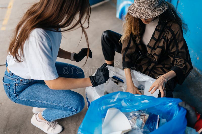 Two Young Women Sorting Garbage. Concept of Recycling. Zero Waste Stock ...
