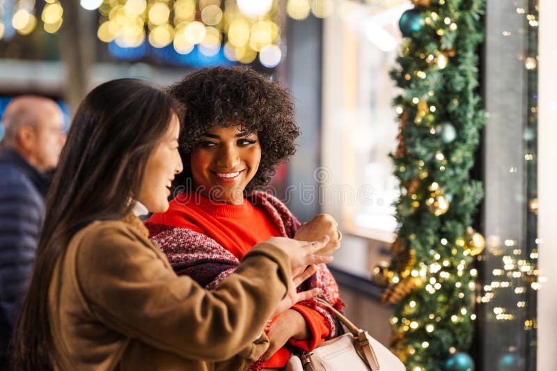 Two Young Women Window Shopping Pointing Christmas Lights Decorations ...