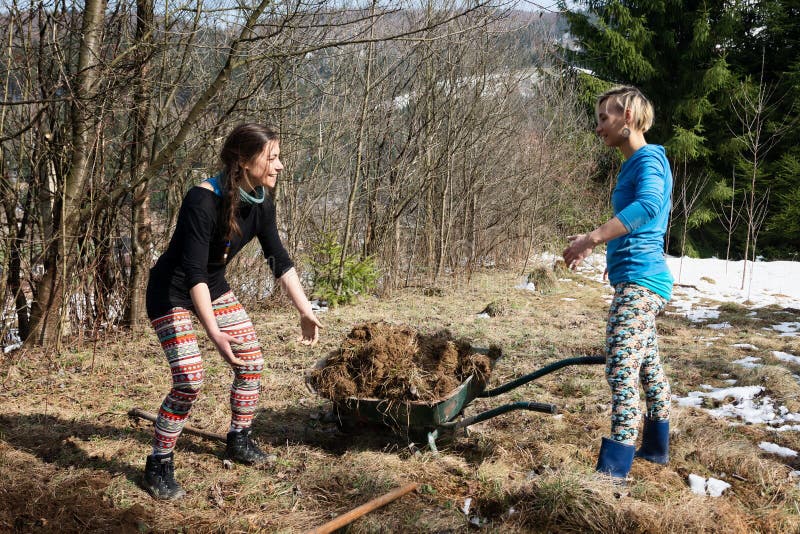 Two Young Women Working the Land on an Idyllic Farm Stock Image - Image ...