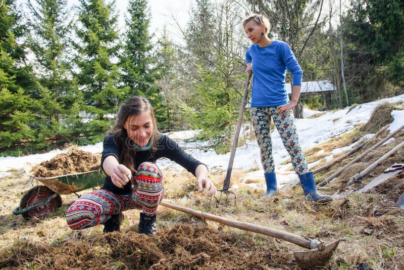 Two Young Women Working the Land on an Idyllic Farm Stock Photo - Image ...