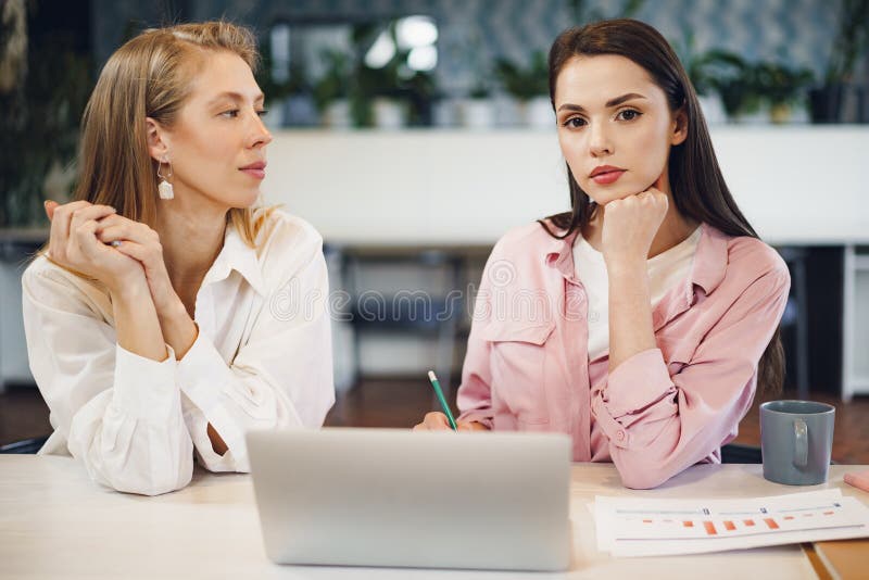 Two Young Women Working Together in Office Stock Photo - Image of ...