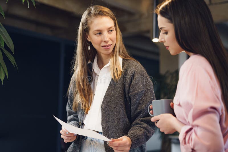 Two Young Women Working Together in Office Stock Image - Image of ...