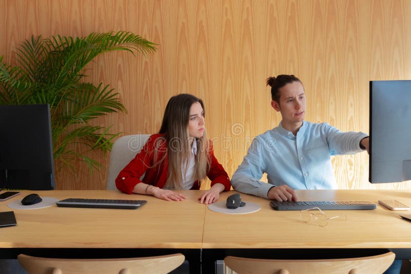 Two Young Workers Working Together in Modern Office Stock Image - Image ...