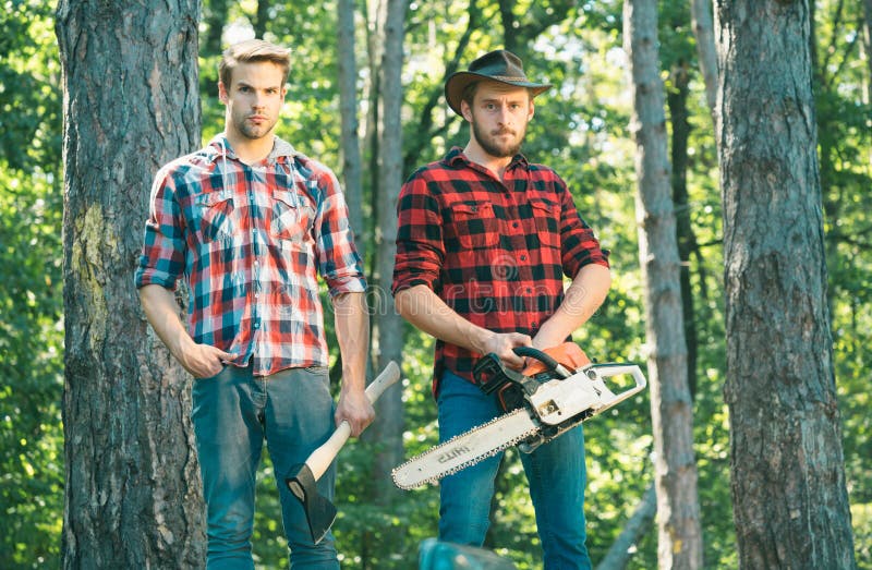 Two Ypung Lumberjack Man Holds Axe. Brutal Lumberjack Concept. Stock ...