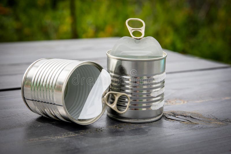 Twp Empty and Opened Cans on Wooden Table Stock Photo - Image of dump ...