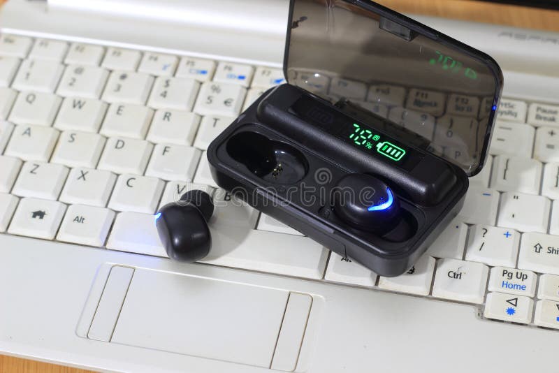 Close Up TWS or True Wireless Stereo at White Notebook Stock Image ...