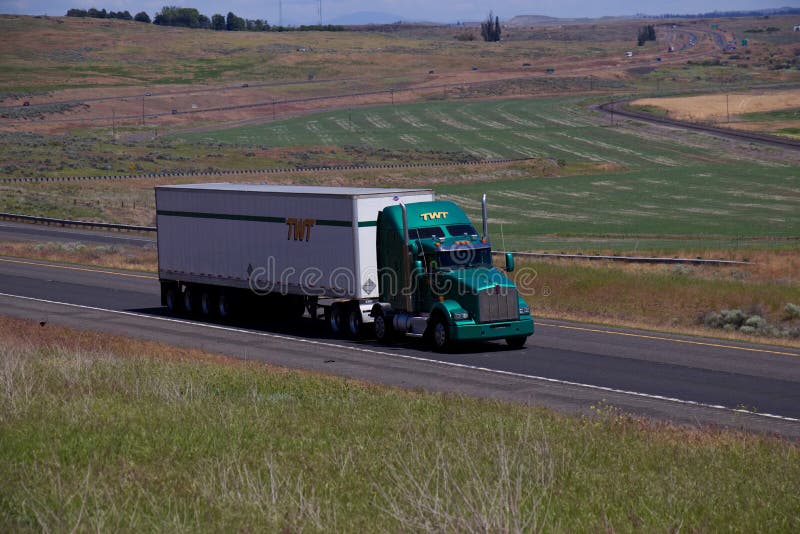 Two Green Kenworth T327 Heavy Trucks of the Toll Company Transporting ...