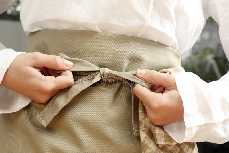 Tying an Apron Around the Waist Stock Image - Image of people, color ...