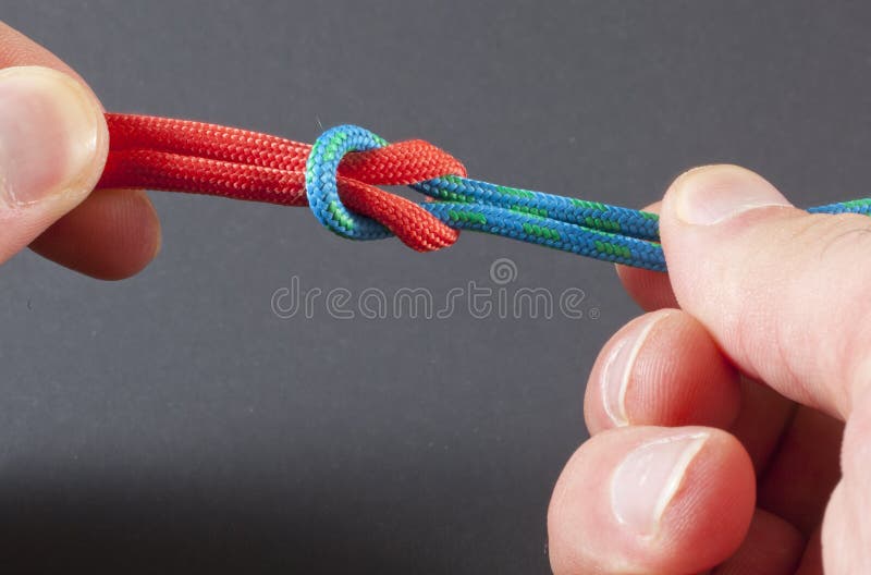 Tying a Square Knot stock image. Image of hand, square - 31013079