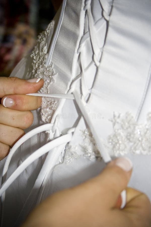 Tying up bride s dress stock image. Image of bride, hands - 4647773