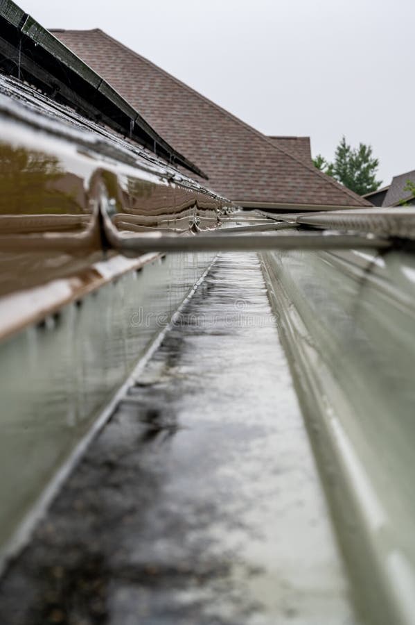 Selective Focus on a Section of Residential Guttering with Hanger ...