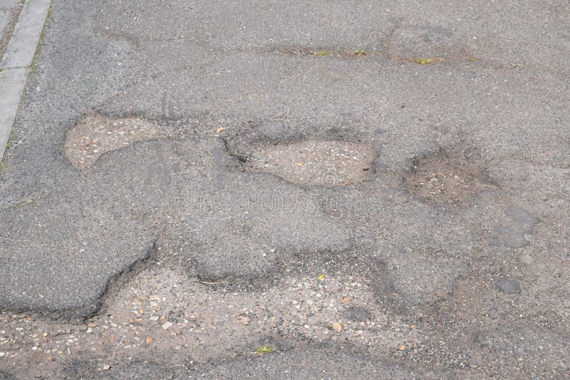 Several deep potholes stock photo. Image of scene, floor - 278542600