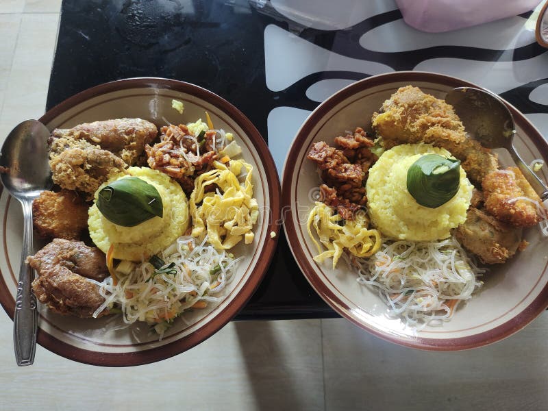 A Typical Indonesian Food is Tumpeng Rice with Yellow Rice Stock Photo ...