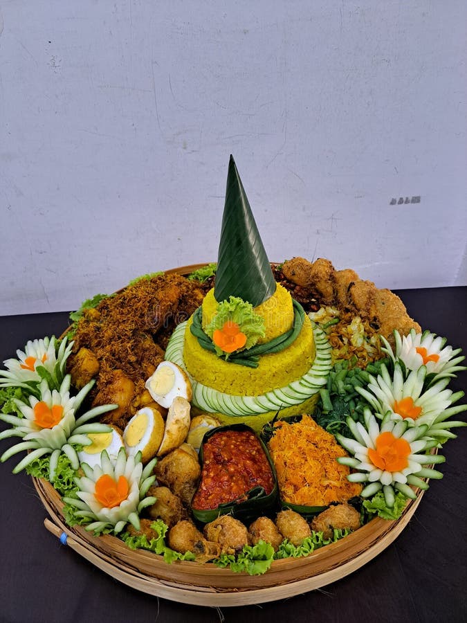 Typical Indonesian Tumpeng Rice with Side Dishes and Vegetables Stock ...