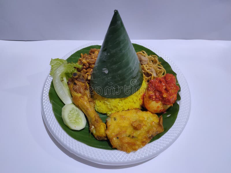 Typical Indonesian Yellow Rice, with Fried Chicken, Eggs and Noodles ...