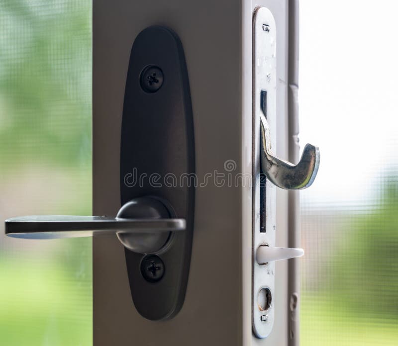 Handle, Locking Hardware, and Jam To a Sliding Glass and Screen Door ...