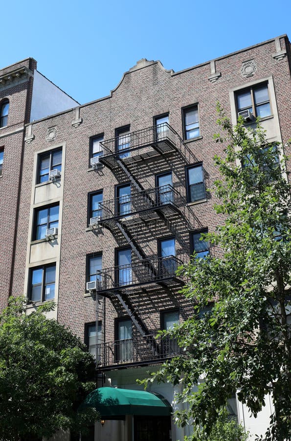 Typical Iron Fire Escape Ladders on the Exterior Facade of a New York Stock Photo - Image of ...