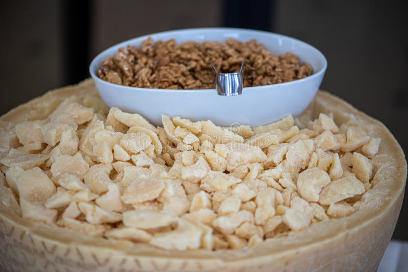 Typical Italian Cheese Wheel Containing Pieces of Cheese and a Bowl of ...