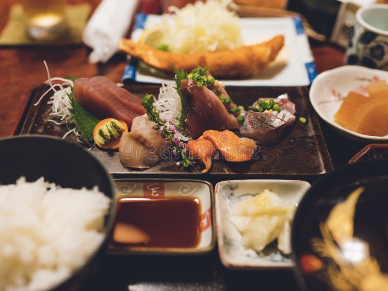 Sashimi Lunch Set Including Rice, Fish, and Several Small Side Dishes ...