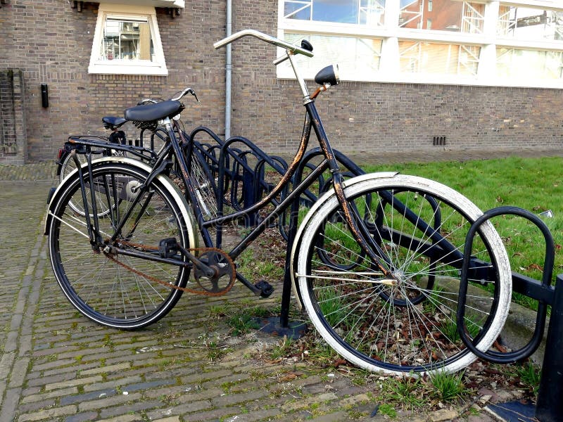 Old Dutch Bike Chained Against a Bridge Stock Photo - Image of chained ...