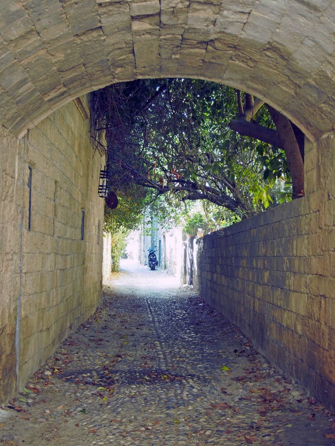 Medieval Cobbled Street in Rhodes Town with Old Buildings and Arches ... Medieval Cobbled Street in Rhodes Town with Old Buildings and Arches ...