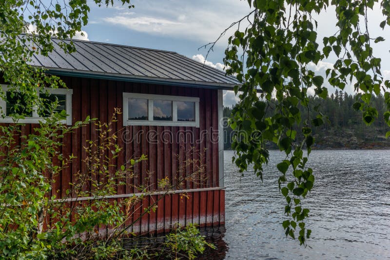 A Typical Red Boat House on the Shore of the Saimaa Lake in Fin Stock ...