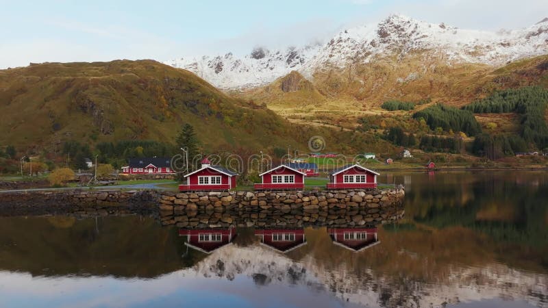 Aerial Glimpse of Typical Red Rorbu Fishing Huts with Sod Roofs in the ... Aerial Glimpse of Typical Red Rorbu Fishing Huts with Sod Roofs in the ...