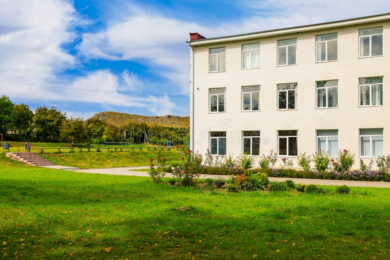 Typical School Building or Educational Institution. Background with ...