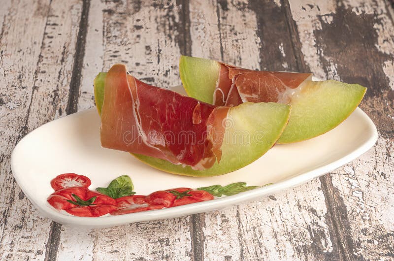 Typical Spanish Food, Melon with Ham on a Plate Decorated with a Blue ...