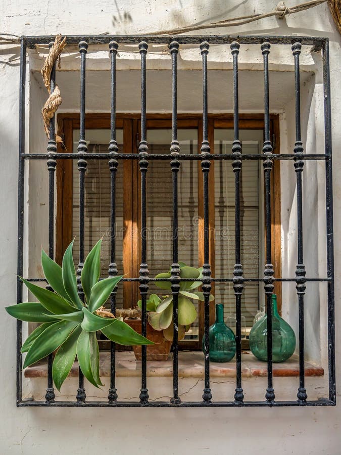 Typical Spanish House Window with House Plants on the Window Ledge ...