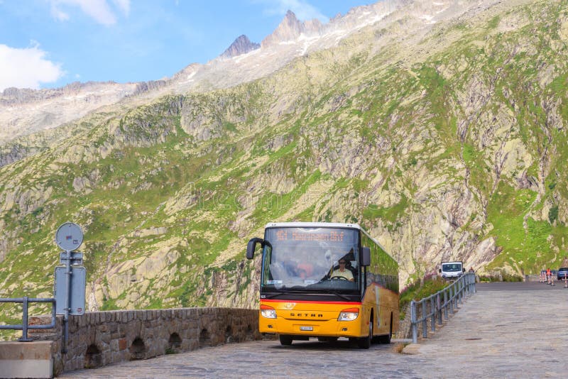 Typical Swiss Yellow Post Bus Postauto at Grimsel Pass, Switzerland ...