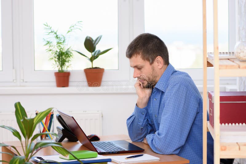 A Typical Weekday Office Specialist Working on a Computer while Sitting ...