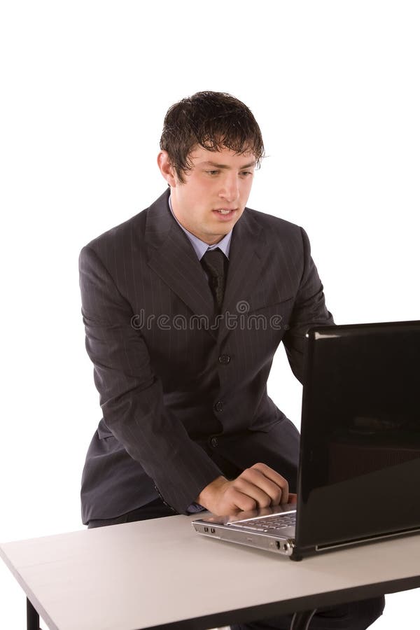 Man with Glasses is Typing on a Keyboard while Sitting in Front of a ...