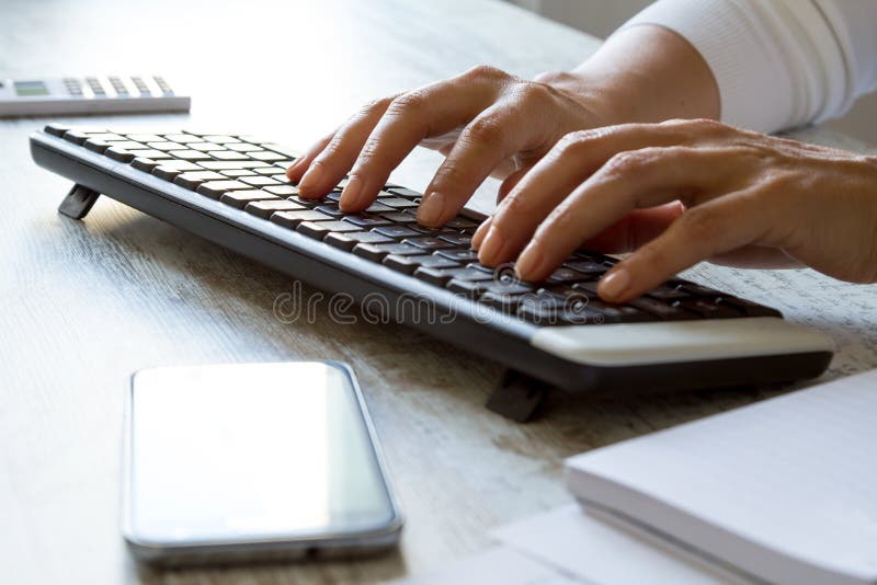 Typing on the computer stock photo. Image of desk, finger - 58713252