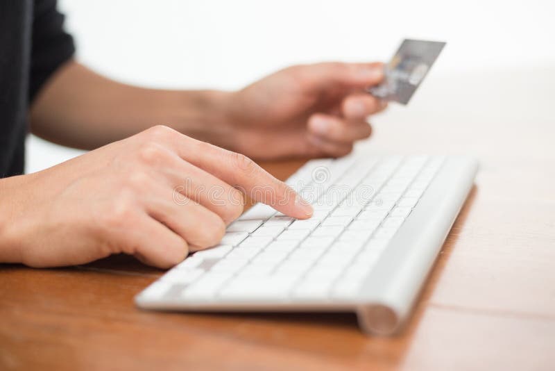 Typing a Keyboard and Holding a Credit Card for Online Shopping Stock ...
