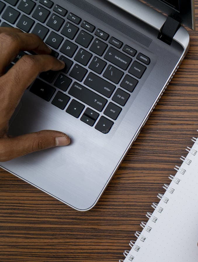 Typing on a Keyboard while Working on a Project. a Lap Top, a Mobile ...