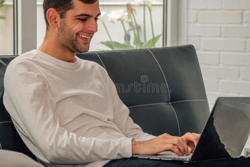 Smiling Man with Computer at Home Stock Photo - Image of freelance ...