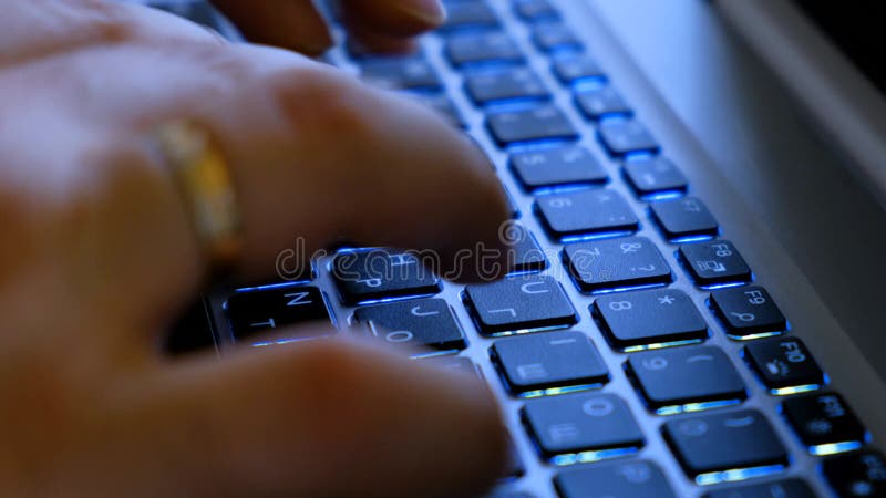 Typing on a Laptop Keyboard in Close-up. Hands Typing on Computer Keys ...