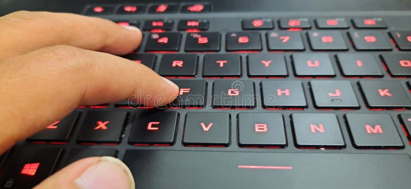 Typing on the Laptop Keyboard with Red Backlight Stock Image - Image of ...