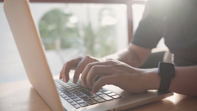 Typing on a Laptop Keyboard while Wearing a Smart Watch Stock Photo ...