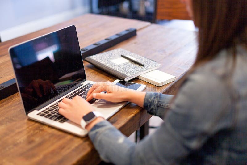 Typing on a laptop stock photo. Image of laptop, sitting - 73990772