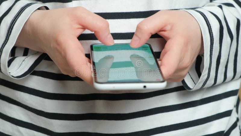 Typing on a Smartphone, Hands in Close-up Typing a Message on a Mobile ... Typing on a Smartphone, Hands in Close-up Typing a Message on a Mobile ...